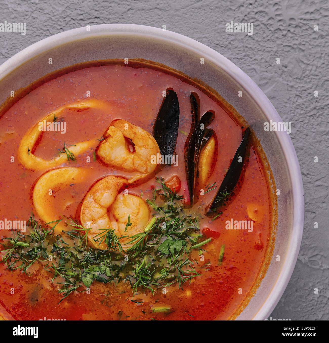 food still-life, Tom yum soup with shrimp, squid and mussels top view ...