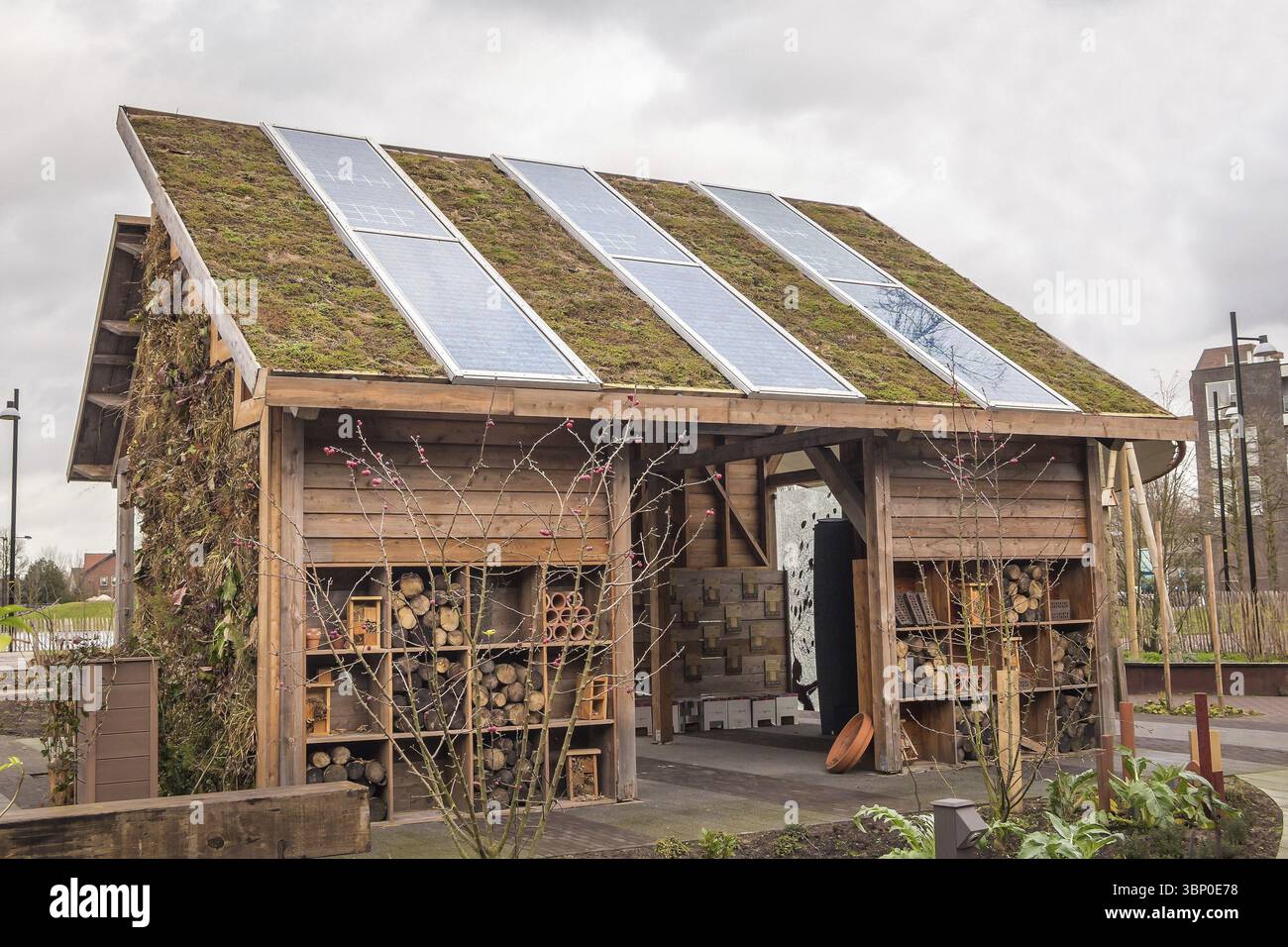 Modern wooden garden stack with solar panels Stock Photo - Alamy