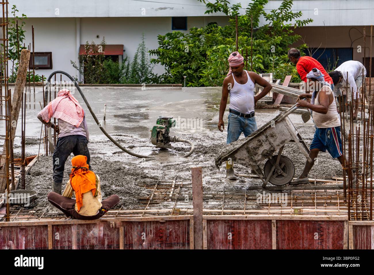July 1st 2025, Dehradun City Uttarakhand India. Manual concrete slab casting at a residential ...