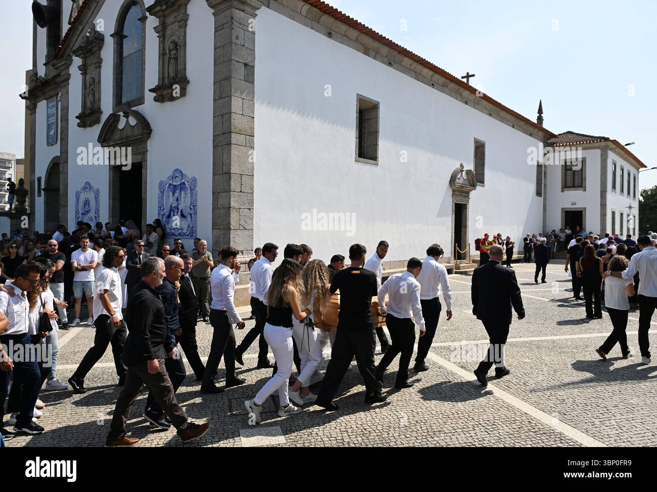 Diogo Jota's wife Rute Cardoso walks with the coffin after the funeral ...