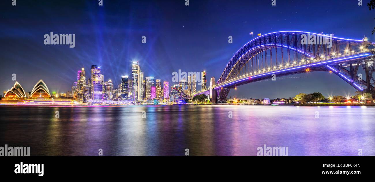 Projections of light show stroboscope beams on major architecture ...