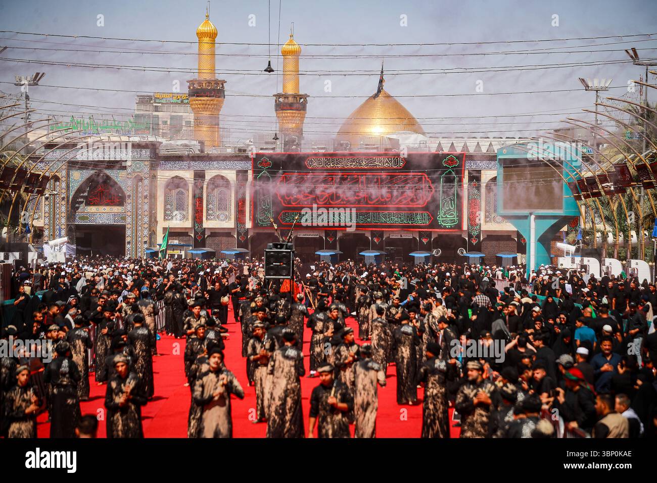 Karbala, Iraq. 05th July, 2025. Iraqi Shiite Muslims take part in the ...