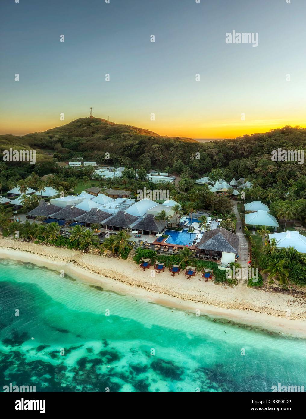 Colourful sunrise over Tokoriki island of Fiji tourism resort ...