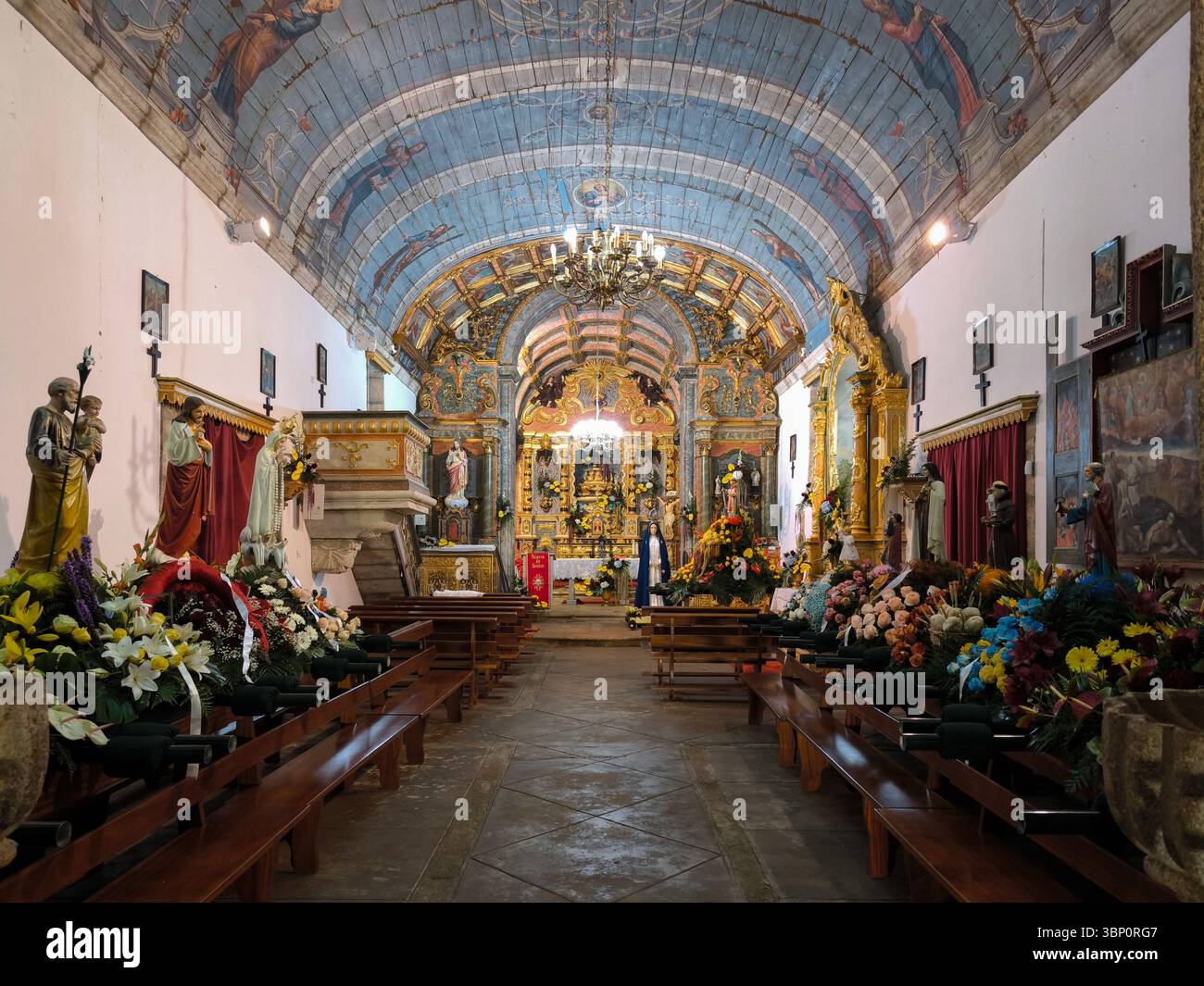 Interior and altar of a Catholic church on a feast day with several ...