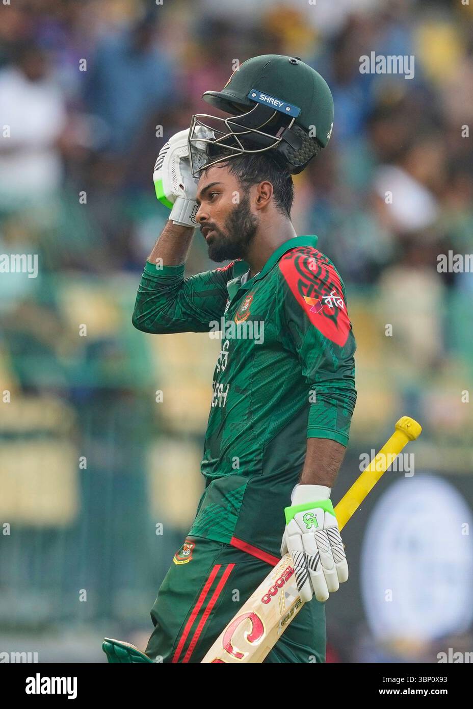 Bangladesh's Towhid Hridoy leaves the ground after losing his wicket ...