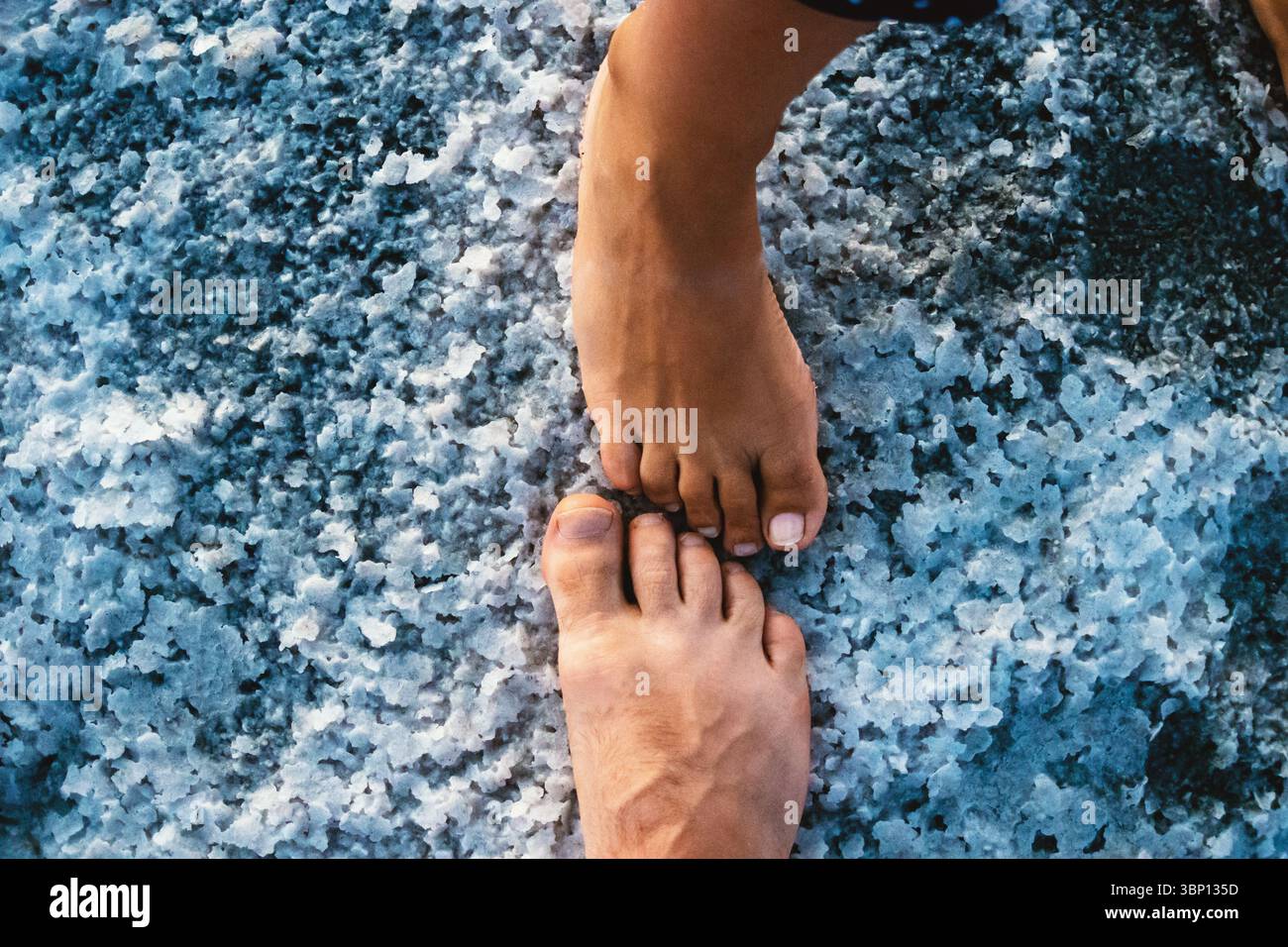 Mans feet on cracked desert hi-res stock photography and images - Alamy
