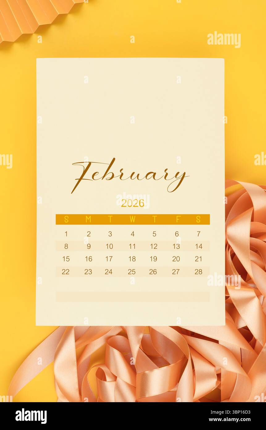 February 2026 calendar page with yellow ribbon Stock Photo - Alamy