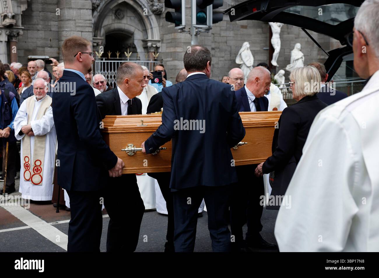 The remains of Brother Kevin Crowley are brought from St. Mary of the ...