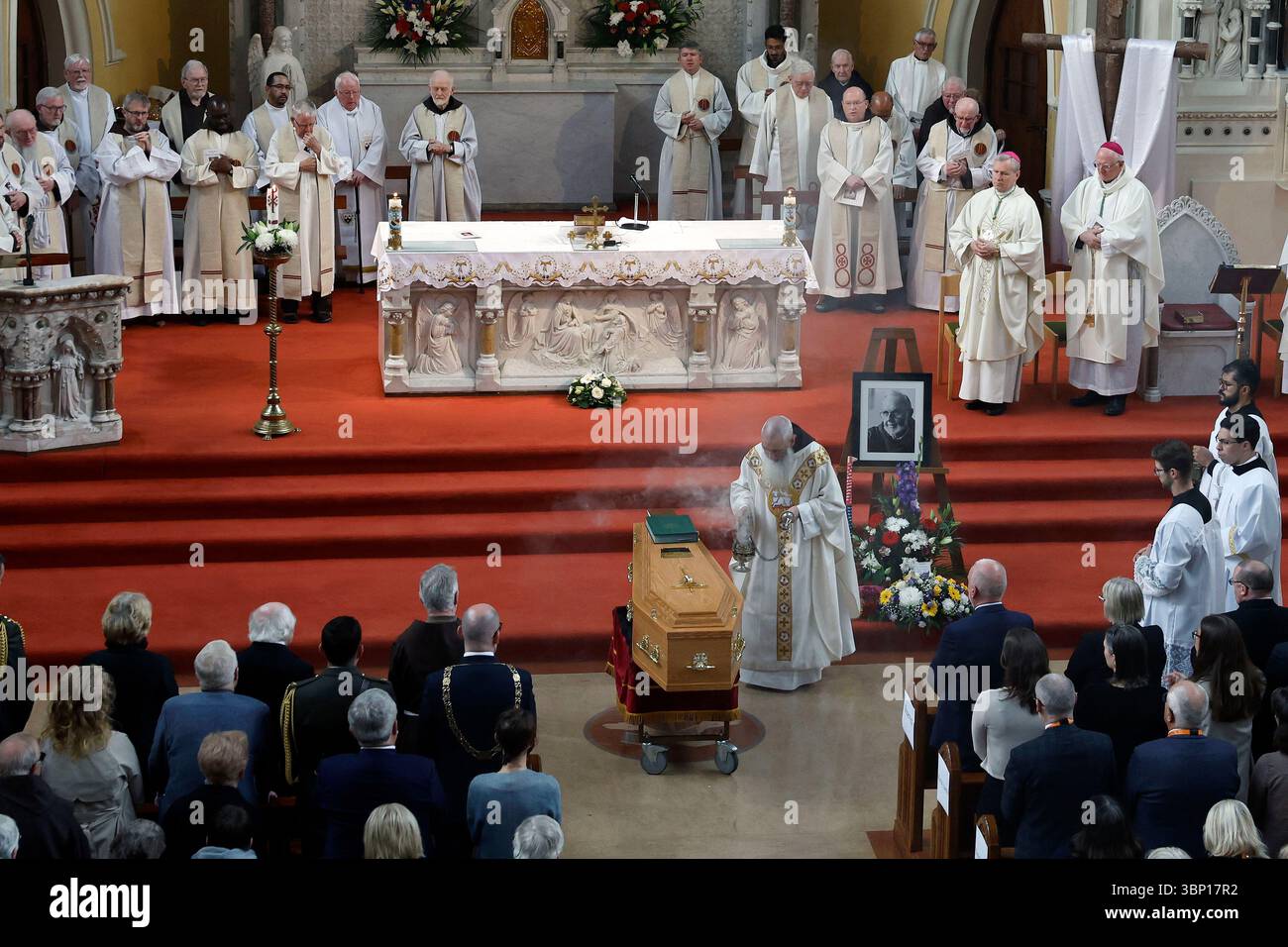 The remains of Brother Kevin Crowley are incensed by Fr. Richard ...