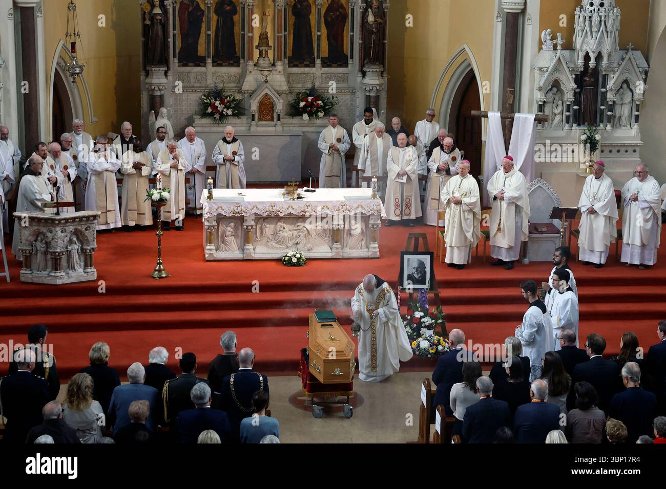 The remains of Brother Kevin Crowley are incensed by Fr. Richard ...