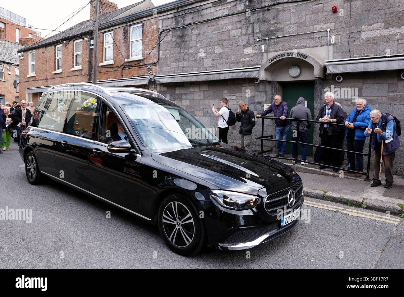 The hearse carrying the remains of Brother Kevin Crowley passes the ...