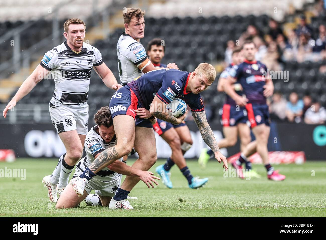 George Delaney of St. Helens is tackled during the Betfred Super League ...