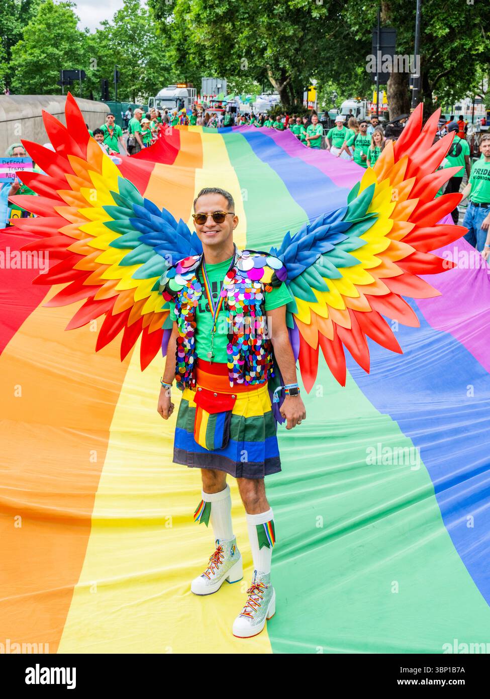 London, UK. 5th July, 2025. The giant rainbow pride flag is led by an ...