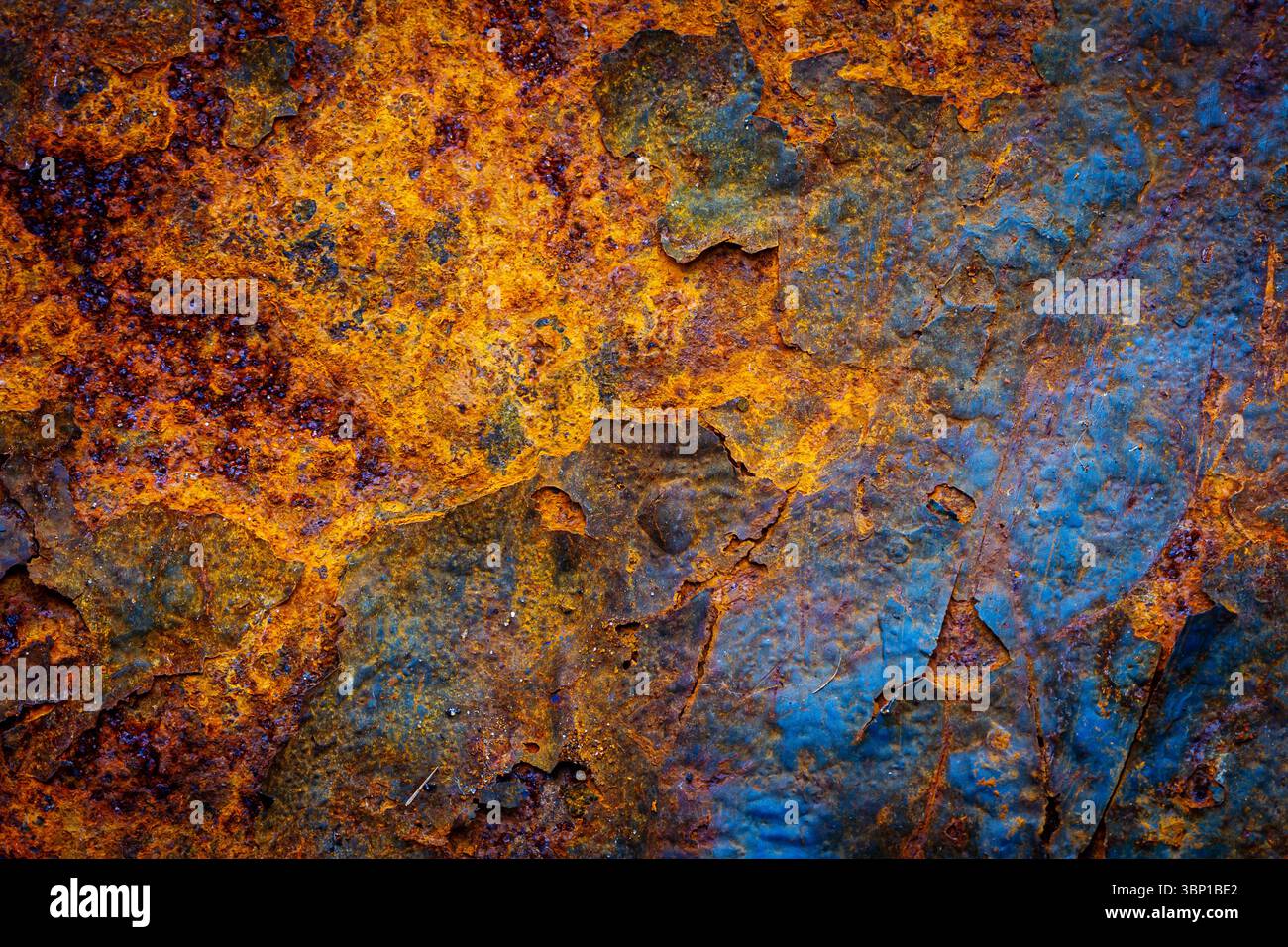 Rusty metal surface with shabby background paint. Blue cracked paint ...