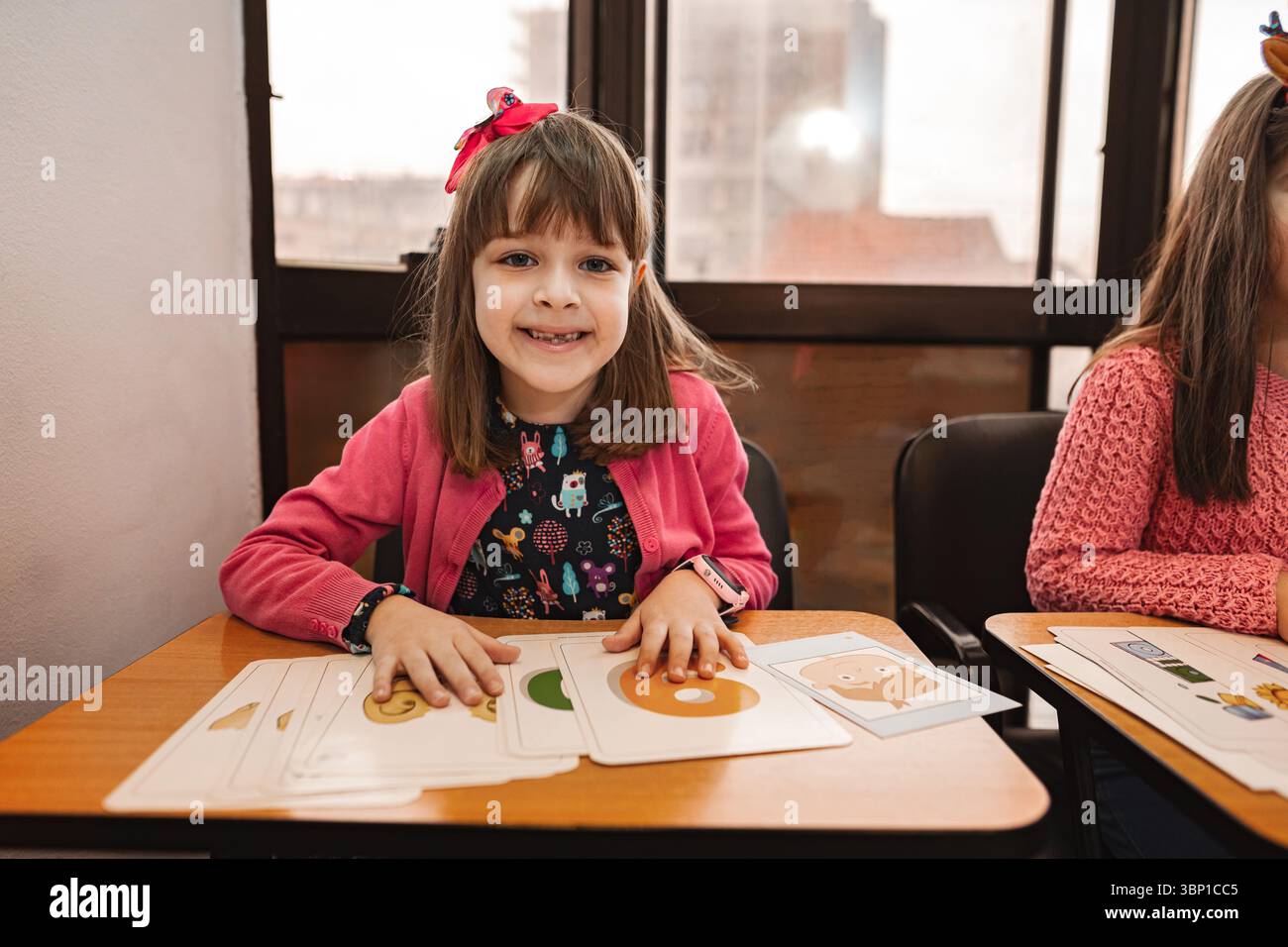 Female elementary students together at language school Stock Photo - Alamy