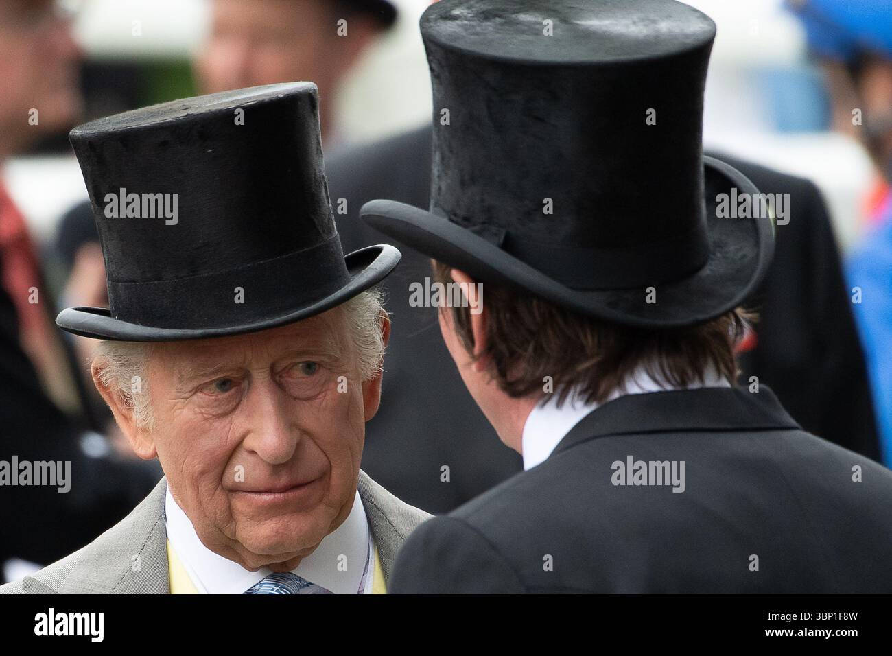 Ascot, UK. 21st June, 2025. King Charles III chats to David Howden in ...