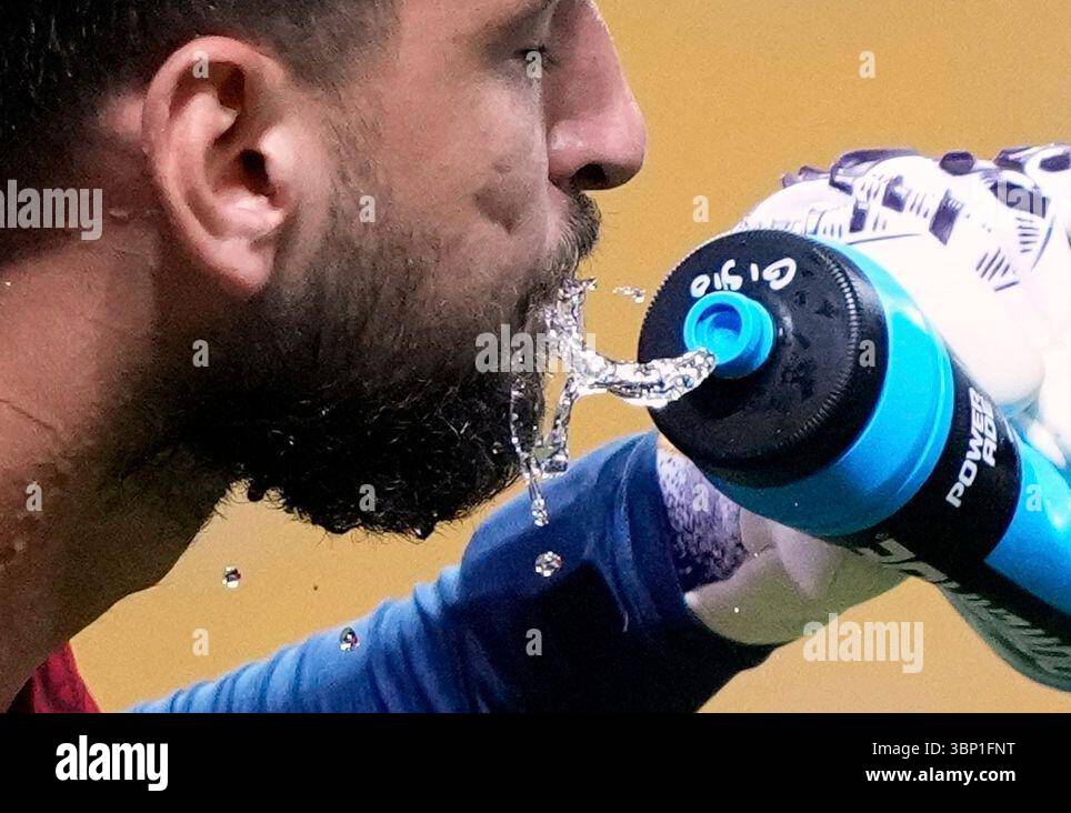 Paris Saint-Germain's goalkeeper Gianluigi Donnarumma takes a drink ...