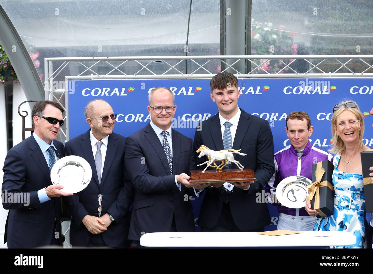 Jockey Ryan Moore (third right) and trainer Aidan O'Brien (left) during ...
