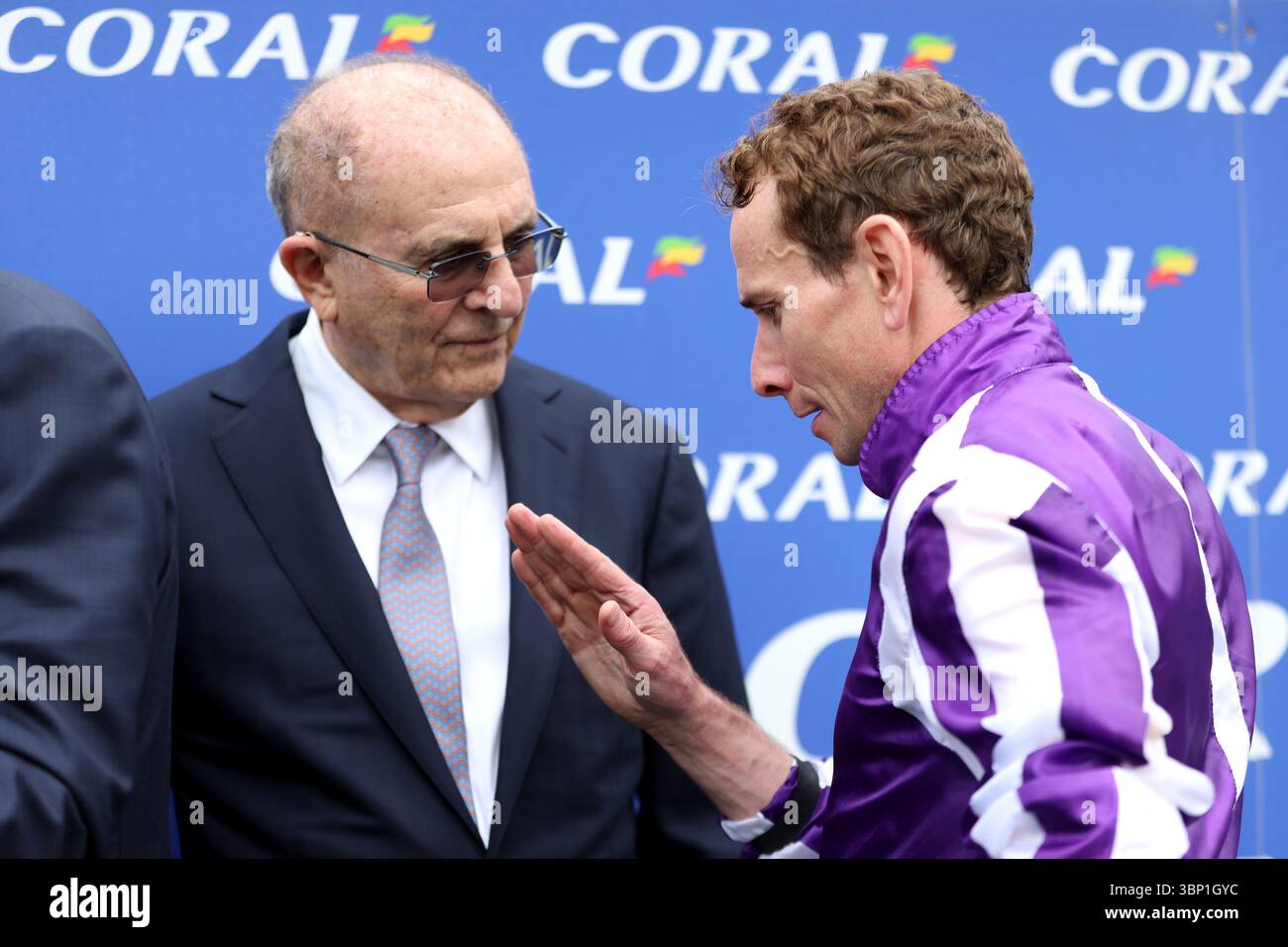 Jockey Ryan Moore (right) during a trophy presentation following ...