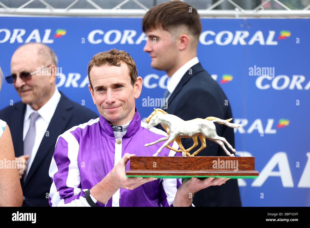 Jockey Ryan Moore during a trophy presentation following victory in the ...
