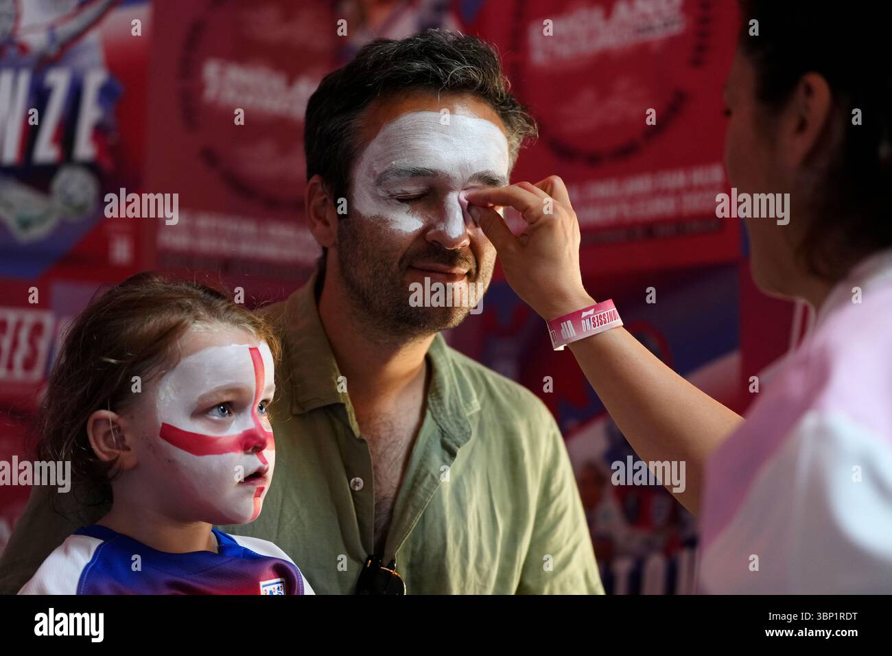 Ada and Piers get their face painted at the fane zone before the UEFA ...