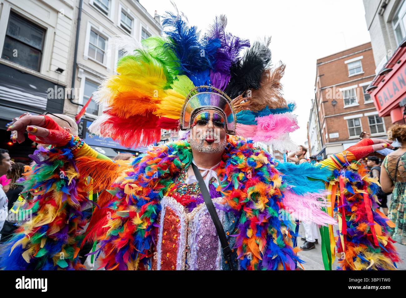 London, UK. 5 July 2025. A costumed reveller in Old Compton Street in ...
