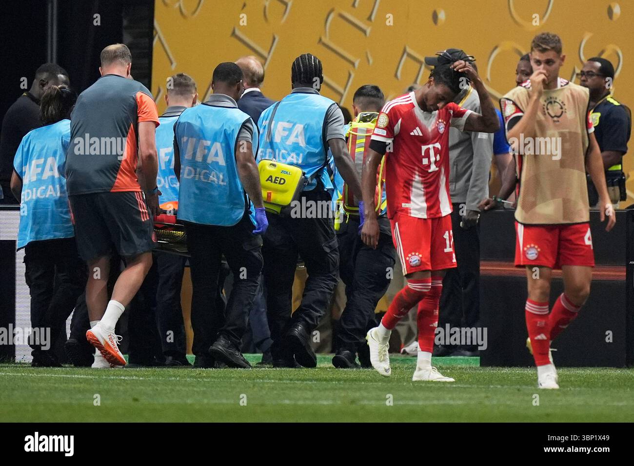 Bayern Munich's Michael Olise (17) and Bayern Munich's Josip Stanisic ...