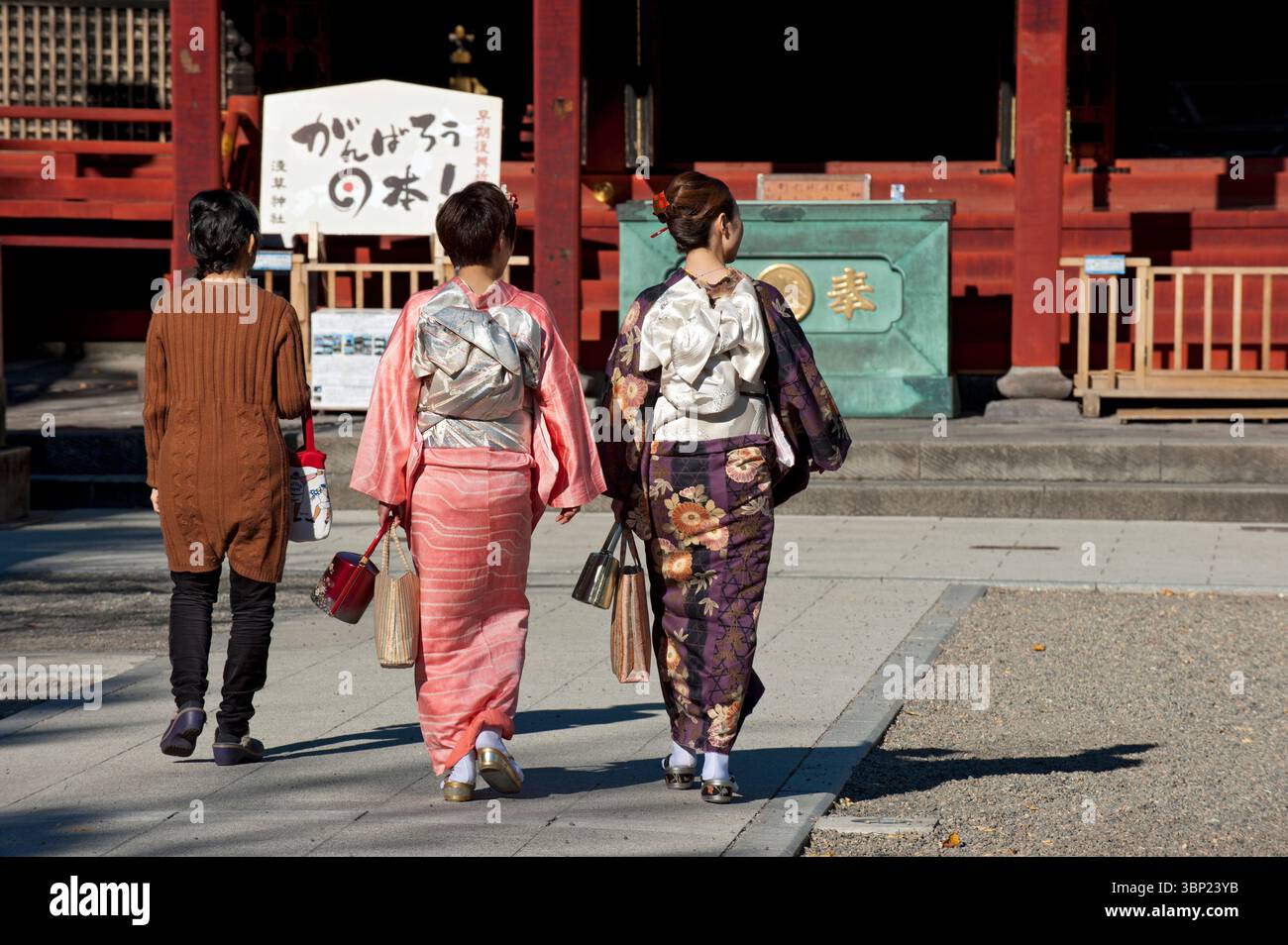 Two women wearing traditional kimono with obi sash visiting Sensoji ...