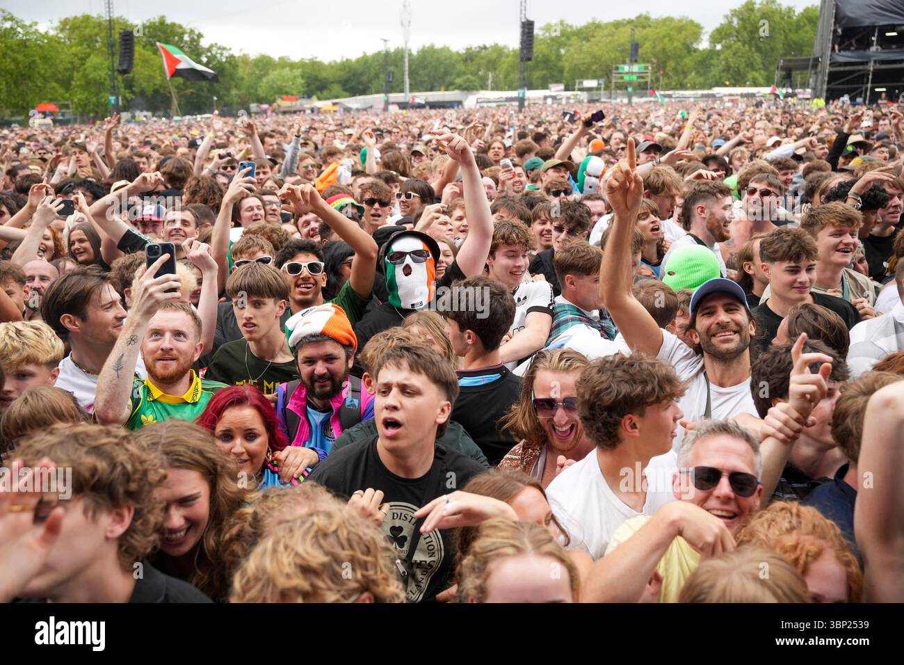 A member of the crowd wearing a balaclava in the colours of the Irish flag during a performance ...