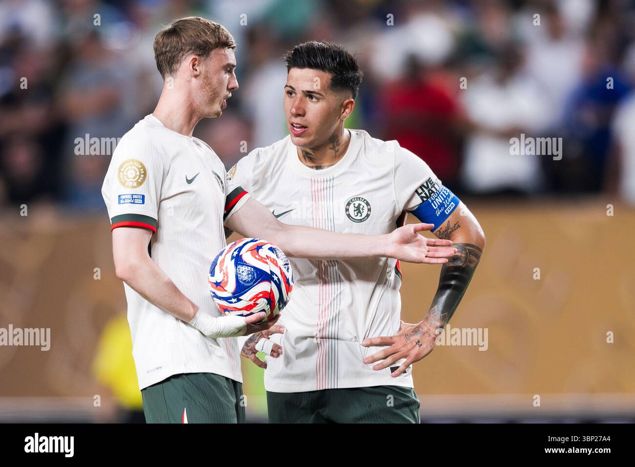 Enzo Fernandez of Chelsea FC speaks with Cole Palmer of Chelsea FC ...