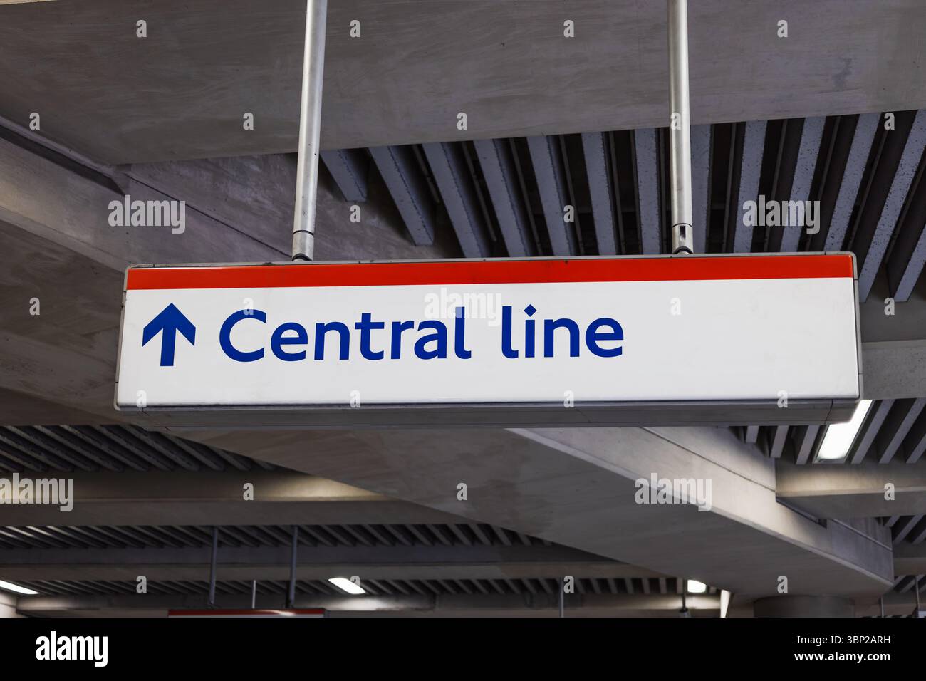 Arrow sign for Central line at London Underground station ceiling ...