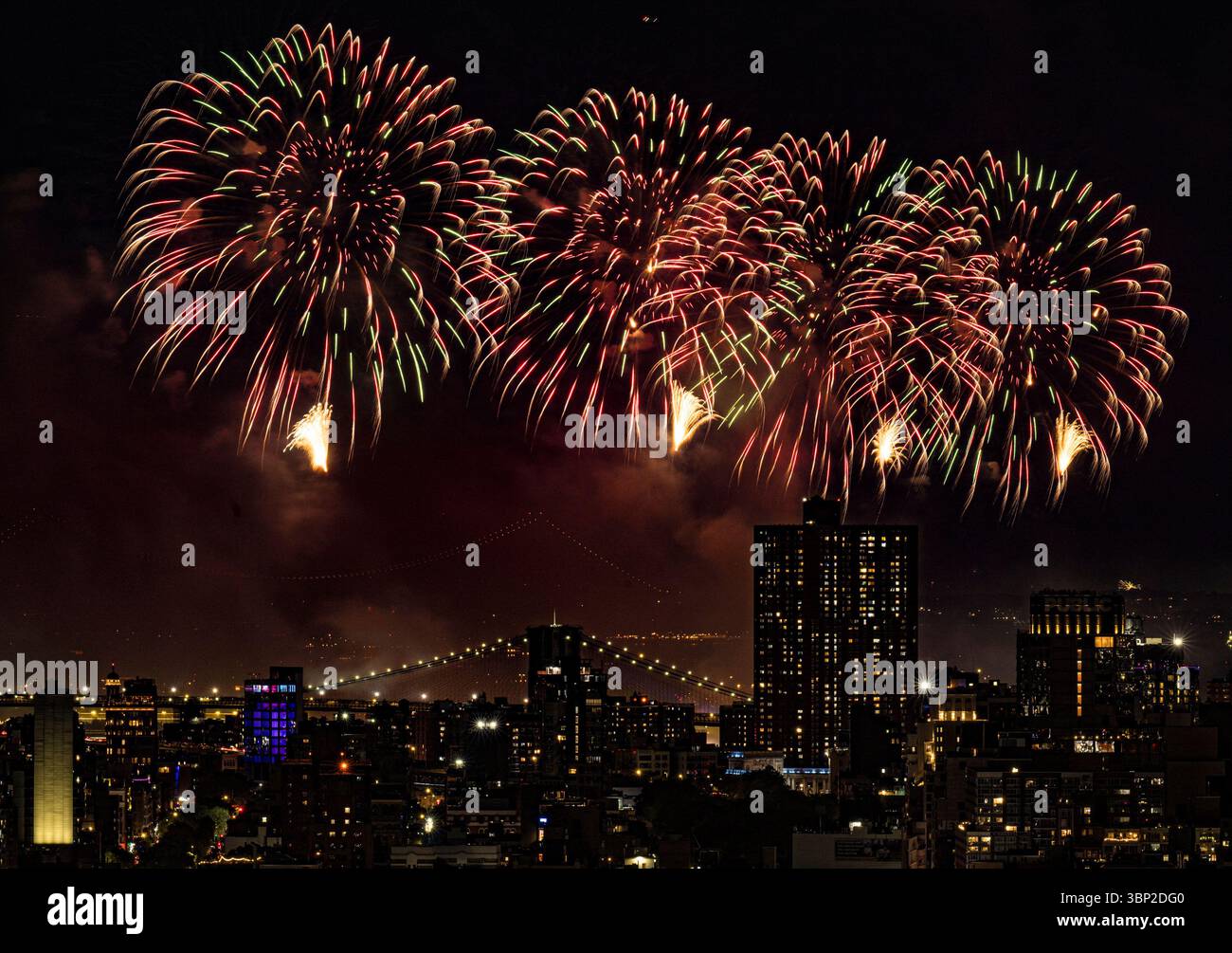 Fireworks explode over the East River and Brooklyn Bridge during the ...