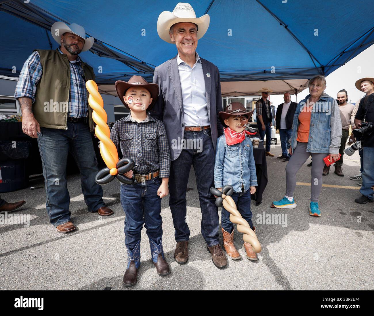 Canada's Prime Minister Mark Carney, centre, poses for a photo as he ...