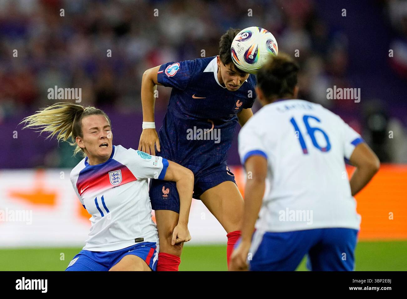 France's Elisa De Almeida heads the ball above England's Lauren Hemp ...