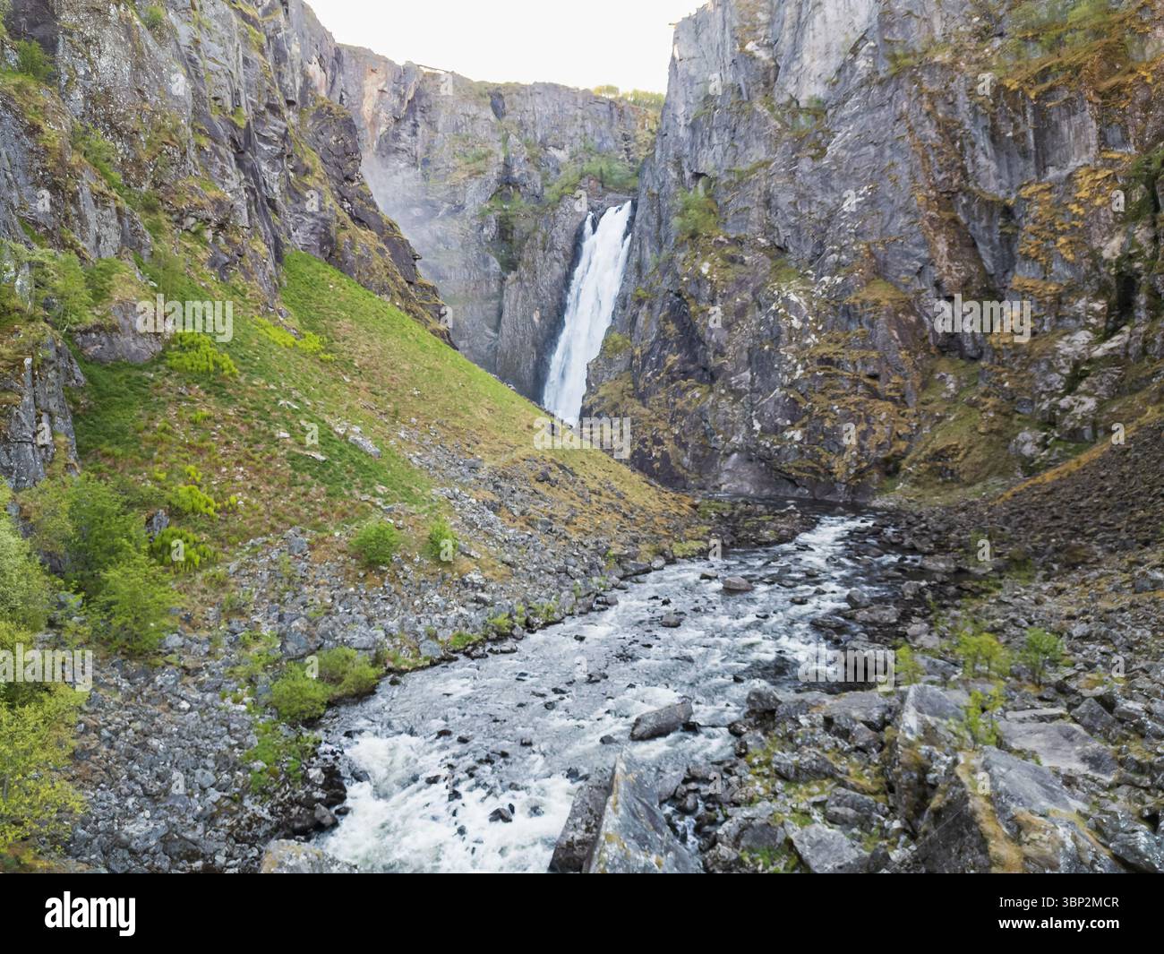 The majestic Vøringsfossen waterfall, cascading into the deep and rocky ...
