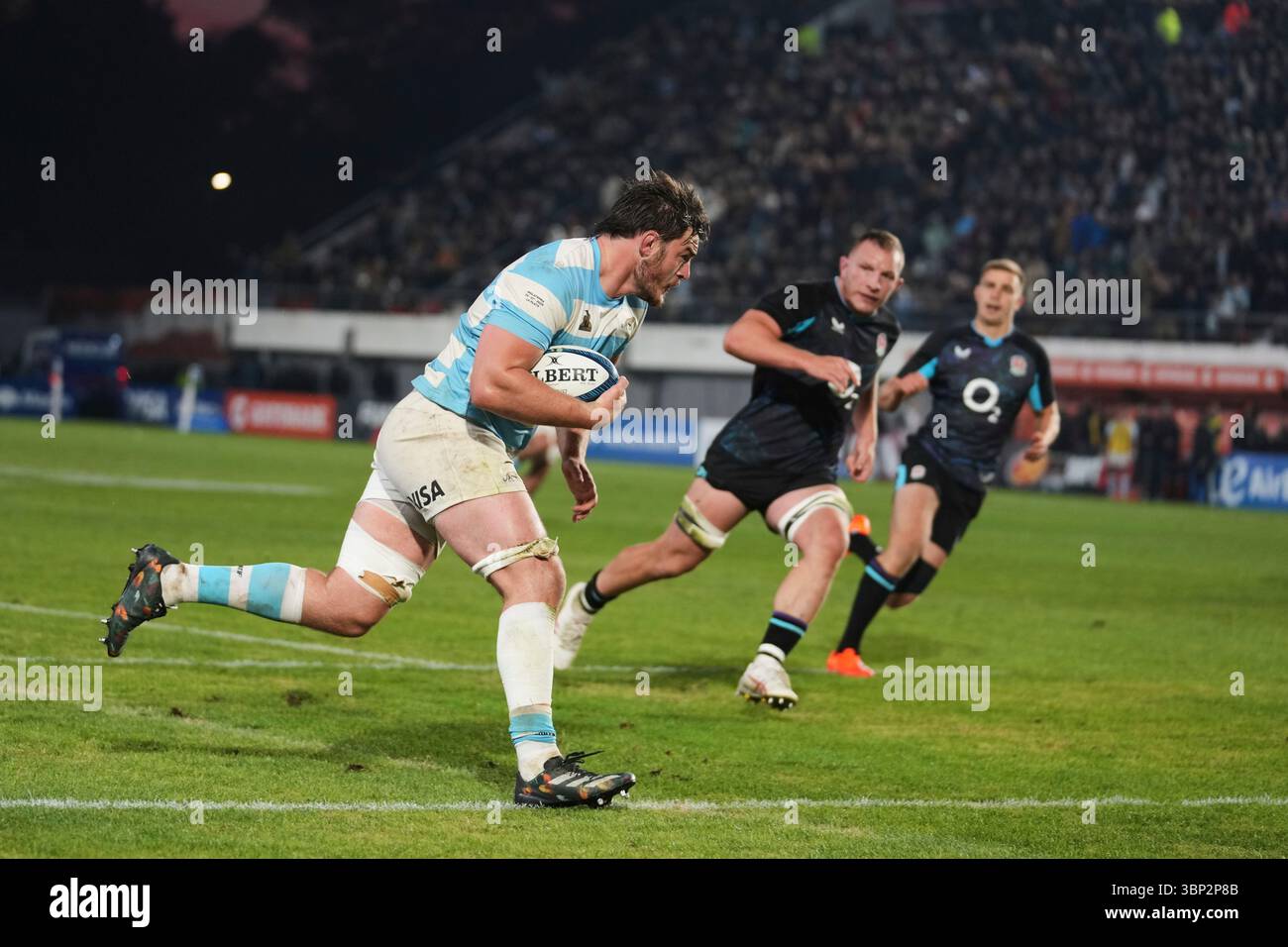 Argentina's Pedro Rubiolo runs to score a try against England during a ...