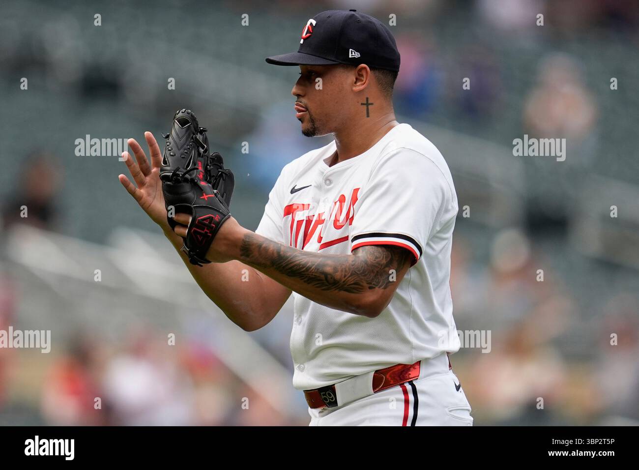 Minnesota Twins relief pitcher Jhoan Duran (59) claps after forcing the ...