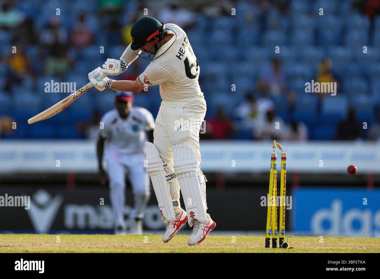 Australia's Travis Head is bowled by West Indies' Shamar Joseph on day ...