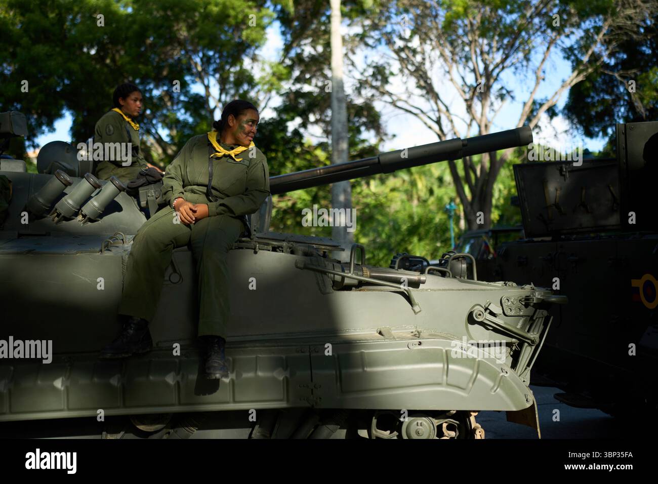 Women soldiers rest on the top of a military vehicle after Independence ...