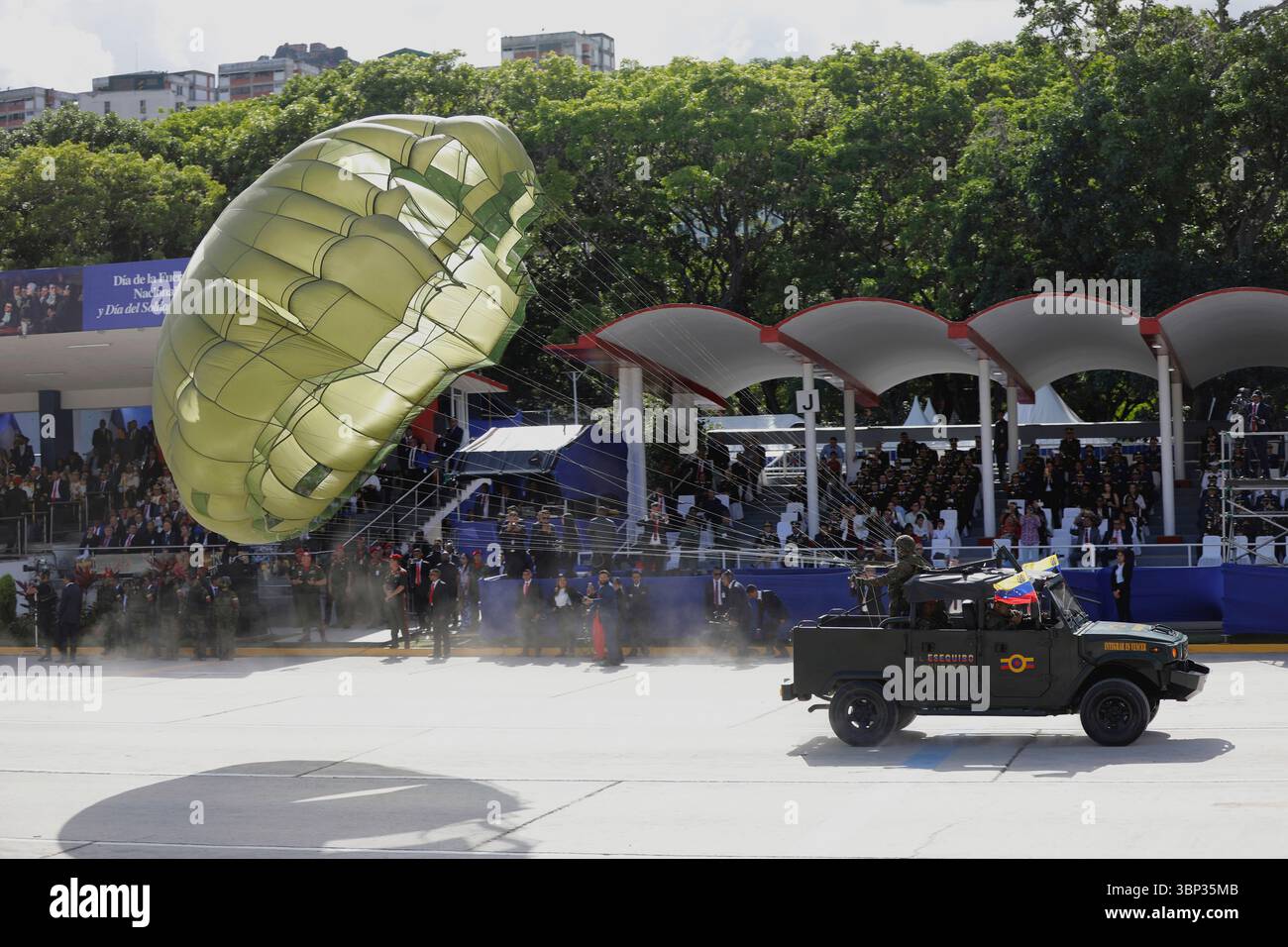 A military vehicle with a deployed parachute during an Independence Day ...