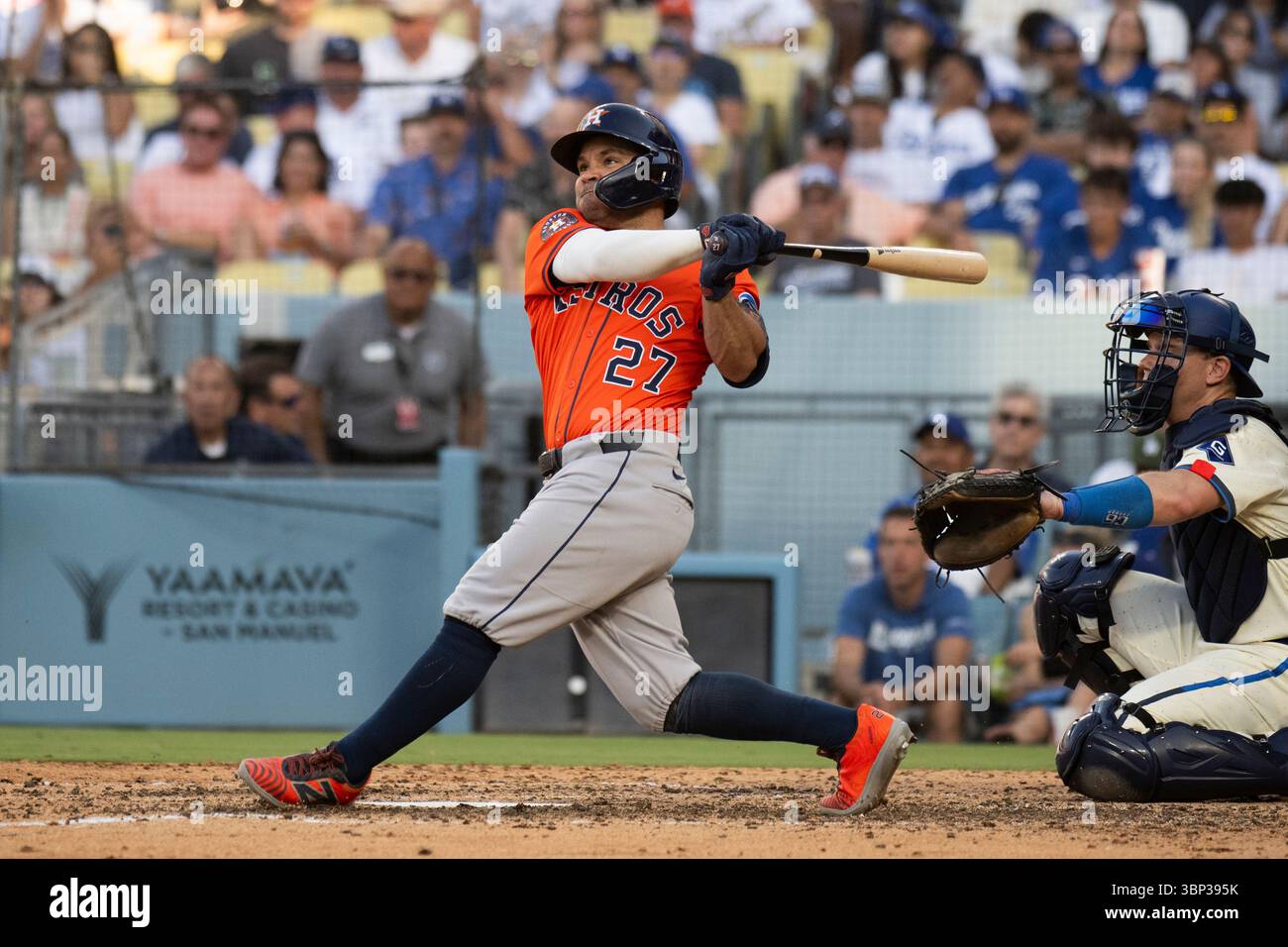 Houston Astros' Jose Altuve hits a triple during the eighth inning of a ...