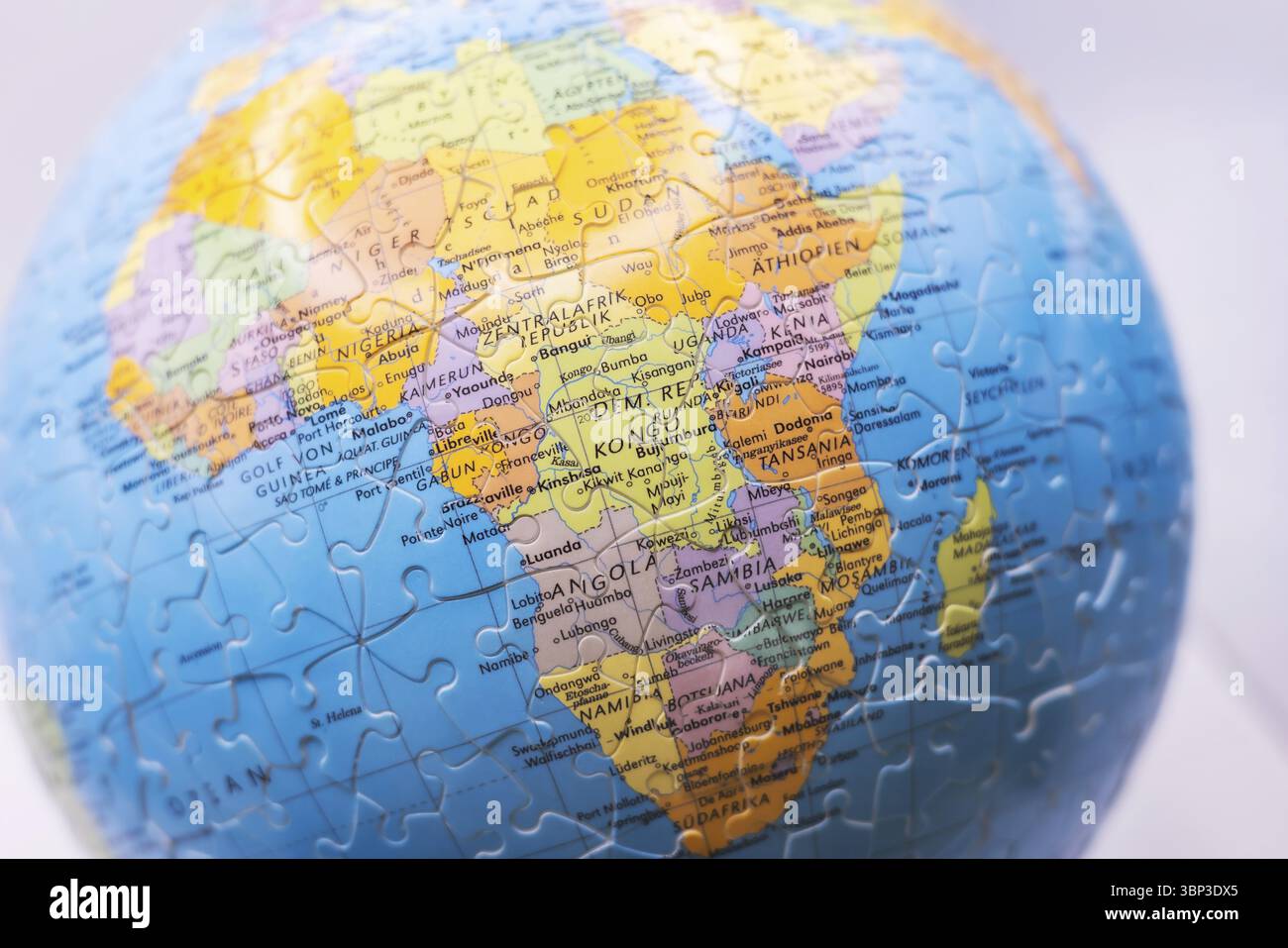Puzzle globe. Map made from puzzle pieces. Africa Stock Photo - Alamy