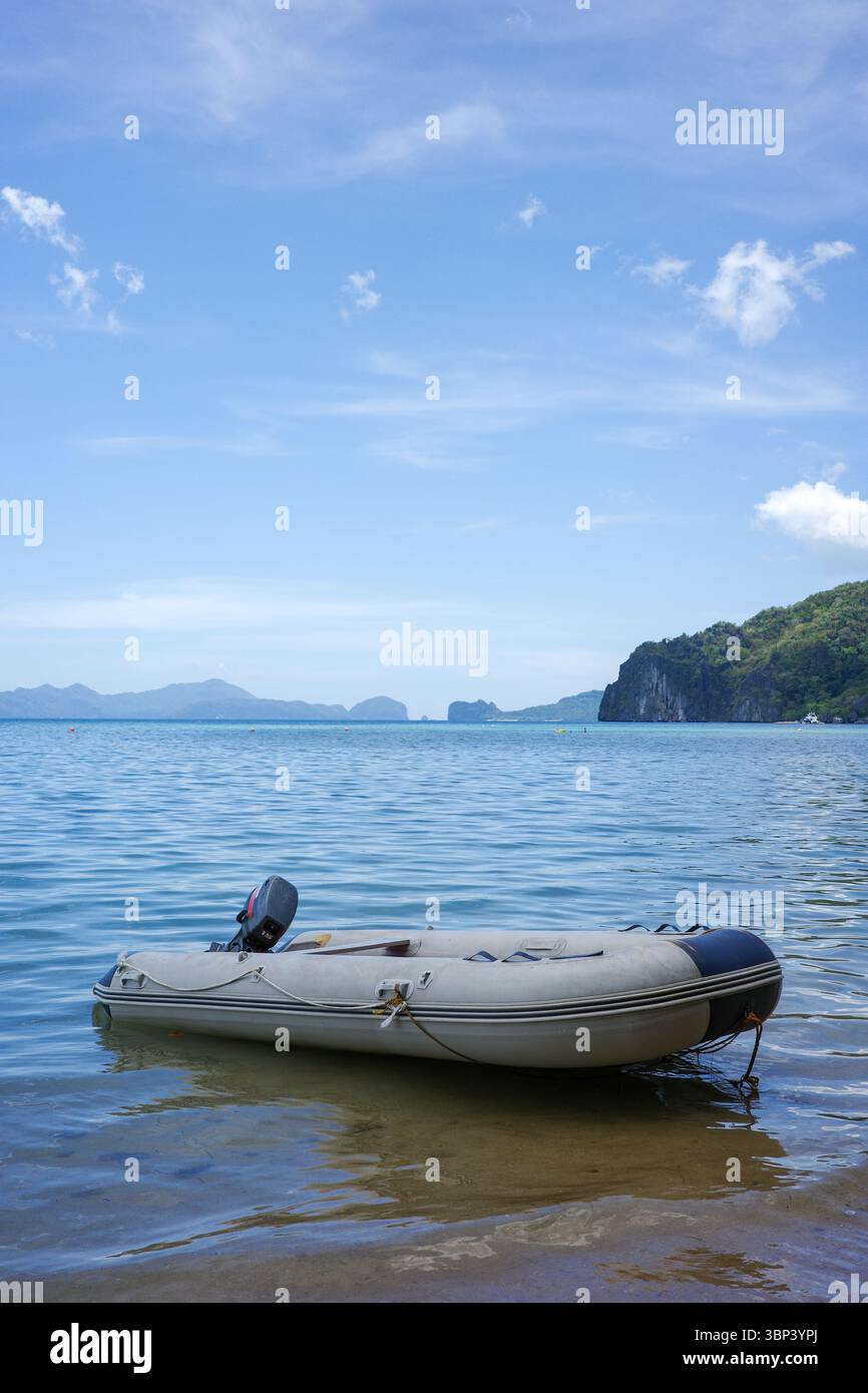 A tranquil tropical view with inflatable boat in El Nido, Palawan ...