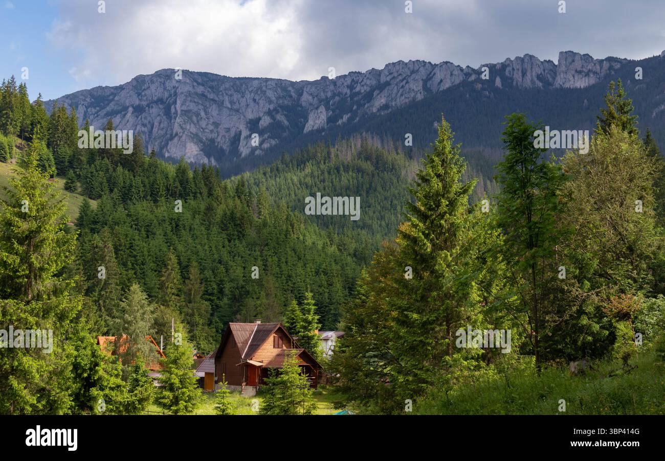Scenic landscape featuring Hasmasul Mare mountain peak visible beyond a ...
