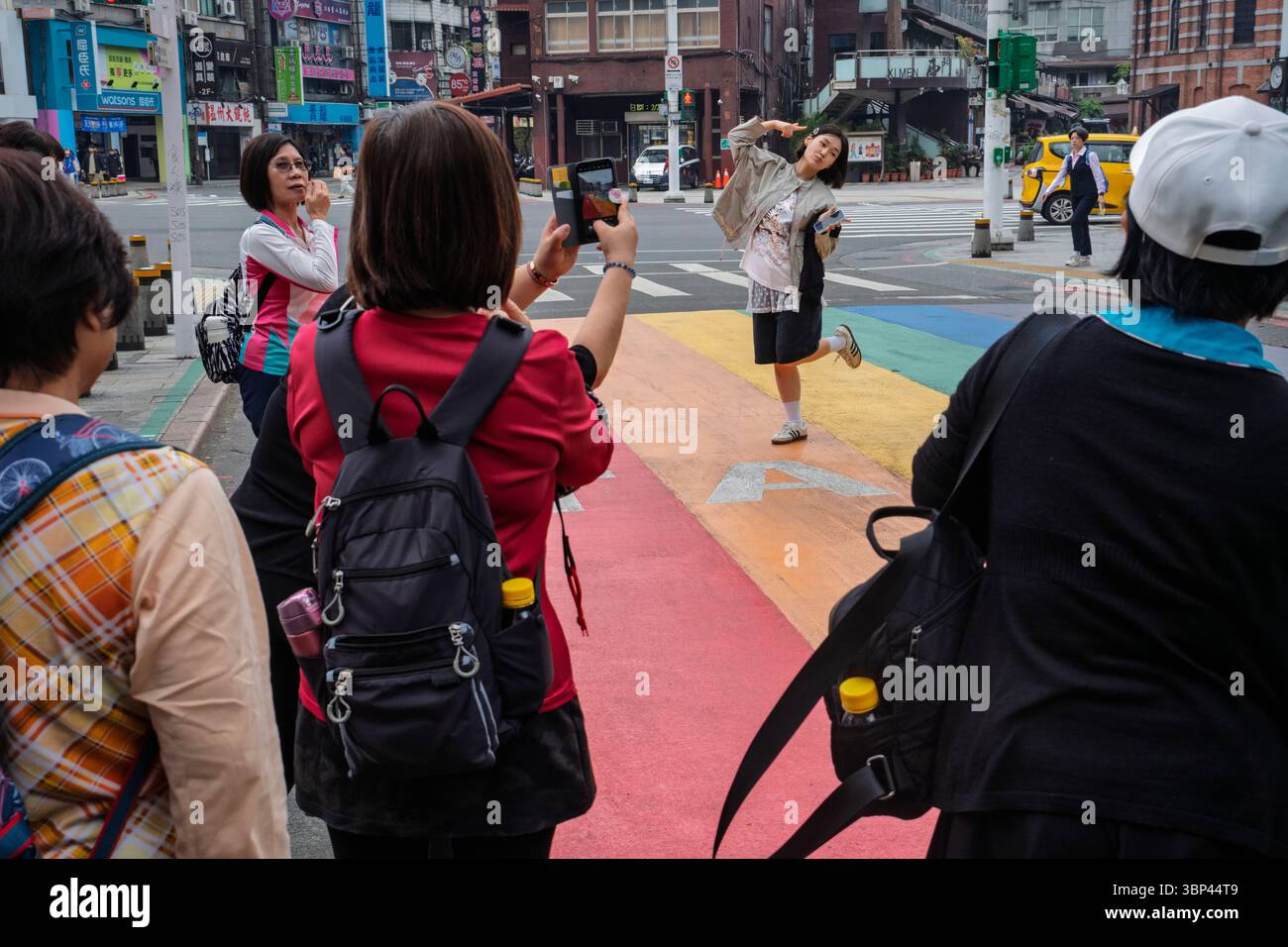 A young woman posing for a photo at Rainbow Six, the famous rainbow ...