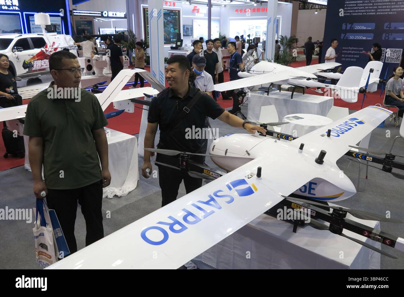 BEIJING, CHINA - JULY 6, 2025 - Visitors visit a satellite communication unmanned aerial vehicle ...