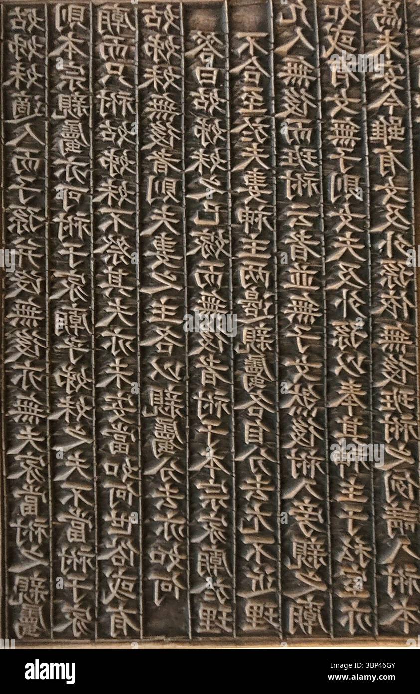 A close-up photograph of a wooden tray filled with Hangul metal ...