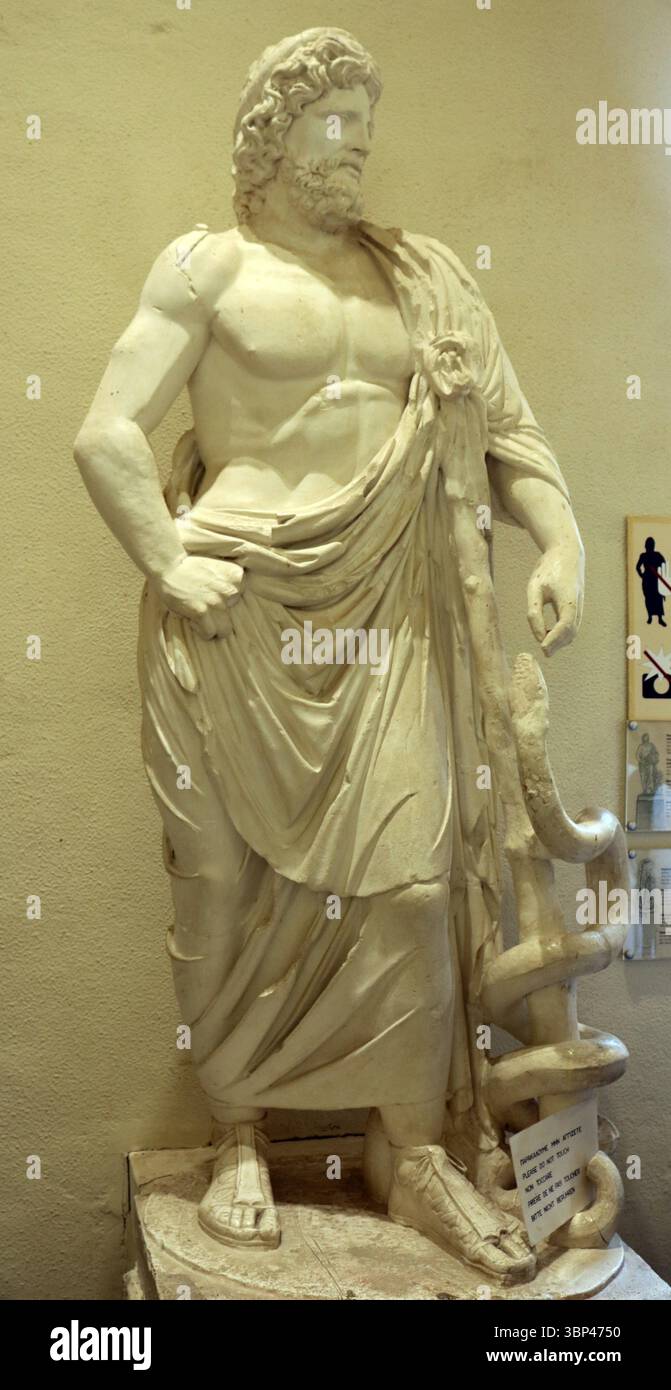 A photograph of a Roman marble statue of Asclepius, with his serpent ...