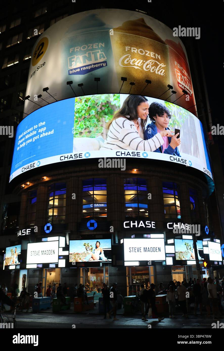 A photograph of nightime entertainment in Times Square, New York City ...