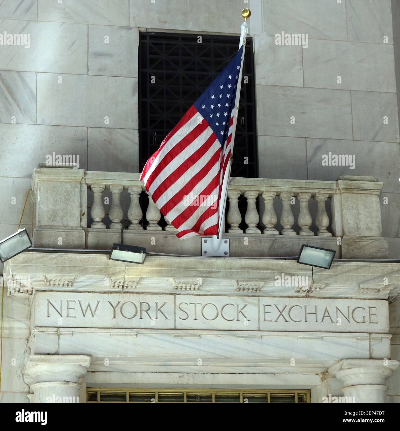 A photograph of the New York Stock Exchange, Wall Street, with the ...